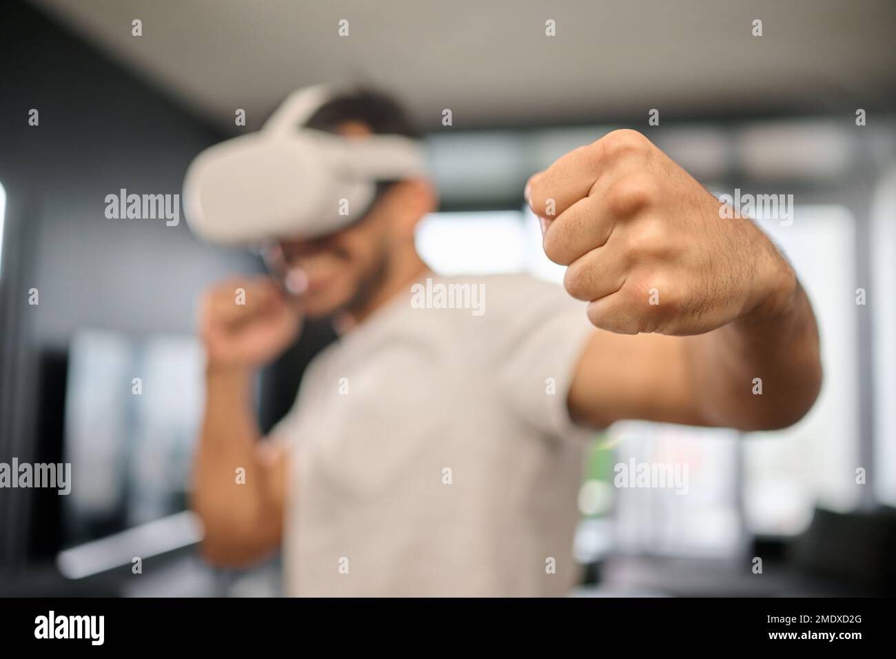 VR, action and fist of a man boxing on a game, training for fight and ...