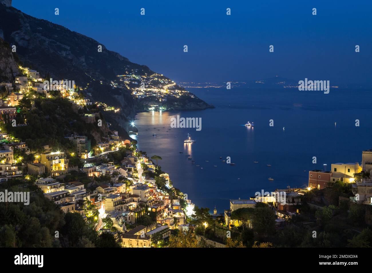 View of cliffside Positano during the evening (blue hour), Amalfi Coast ...
