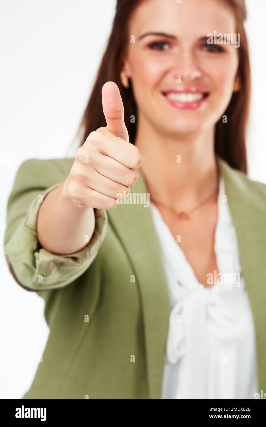 Thats a win for you. Studio portrait of a young woman showing a thumbs ...