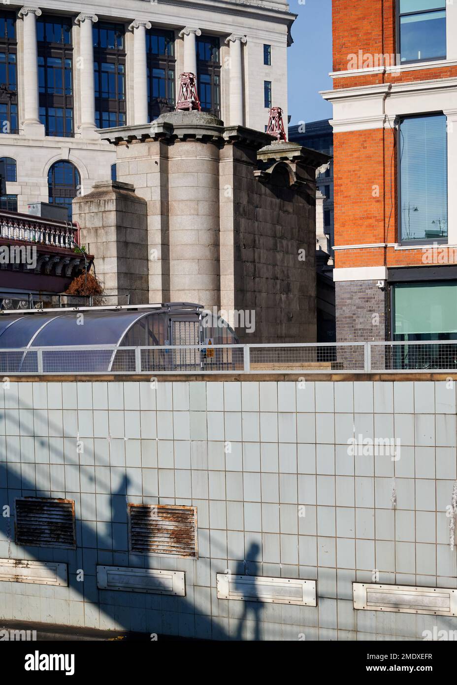 22 Jan 2023 - LondonUK: Shadow of people walking down steps on tiled ...