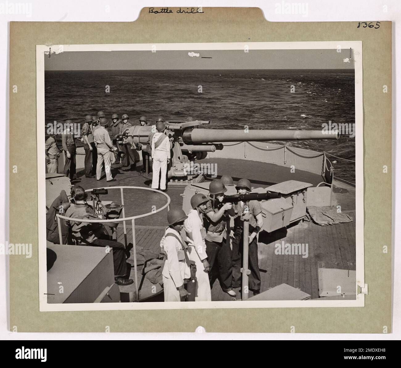 Coast Guardsmen participate in a battle drill, receiving instructions ...