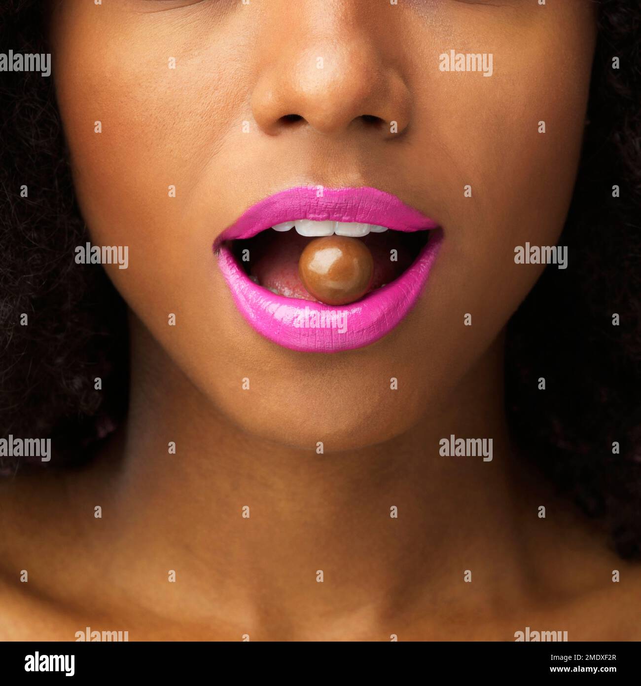 Bite into goodness. an unrecognizable woman posing with a chocolate ...