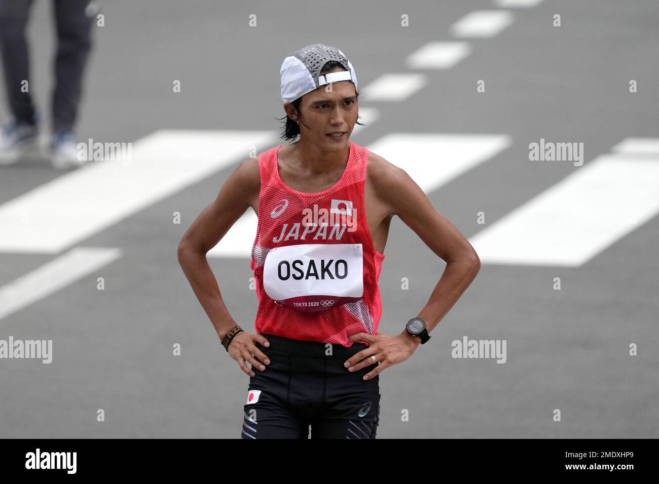 Suguru Osako of Japan, reacts after crossing the finish line during the ...