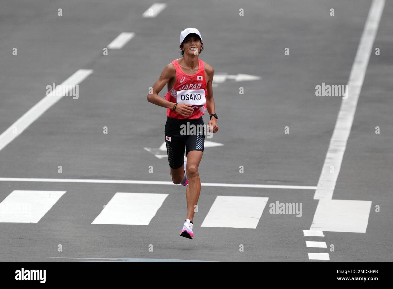 Suguru Osako, of Japan, approaches to the finish line during the men's ...