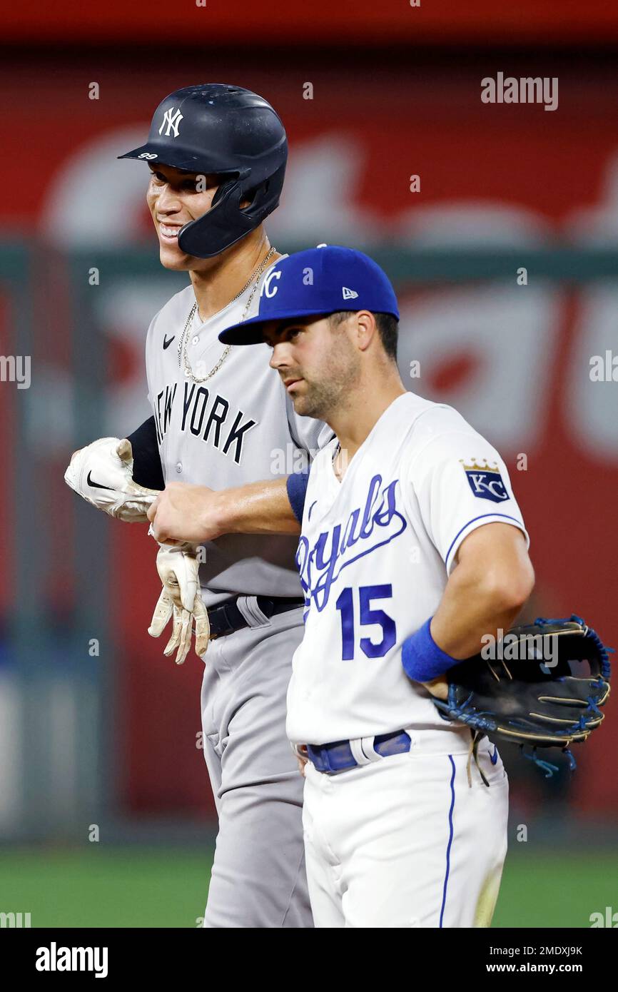New York Yankees' Aaron Judge, left, reacts after hitting a double as ...