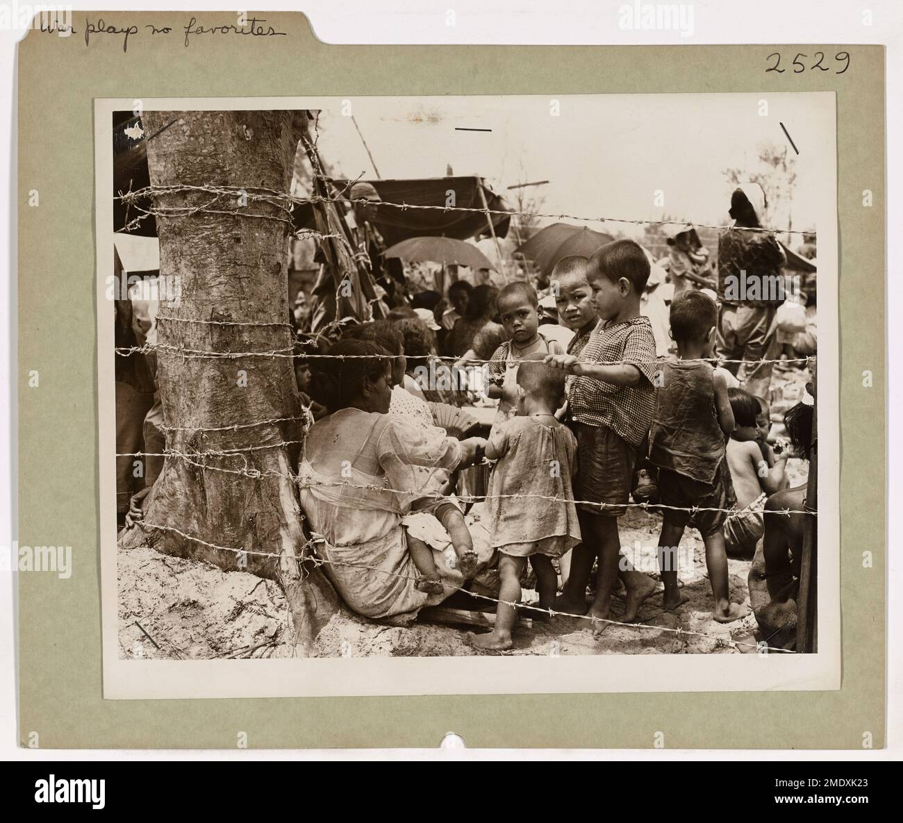 War Plays No Favorites. Japanese children and their mothers are taken ...