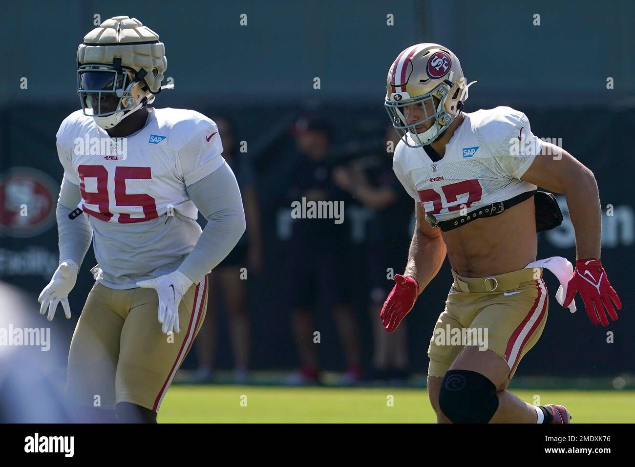 San Francisco 49ers defensive ends Kentavius Street, left, and Nick ...