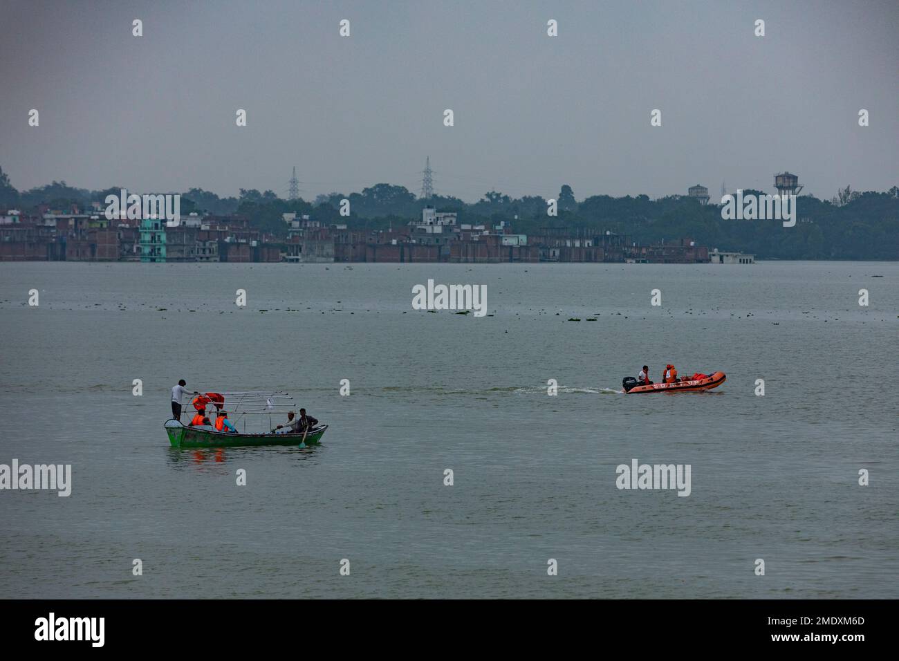 Boats move in the swelling waters of the river Ganges in Prayagraj ...