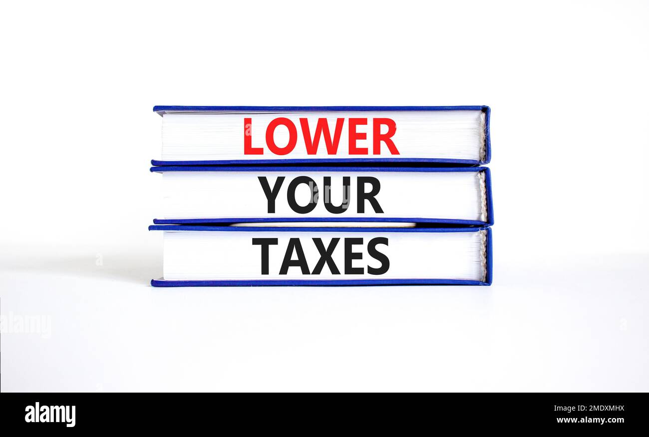 Lower your taxes symbol. Concept words Lower your taxes on books on a ...