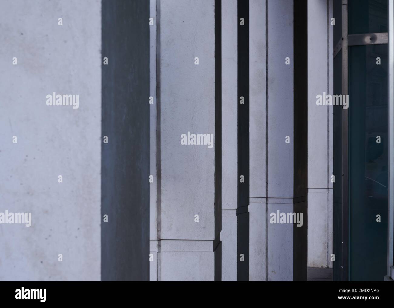 Patterns made on modern building columns in sunshine Stock Photo - Alamy