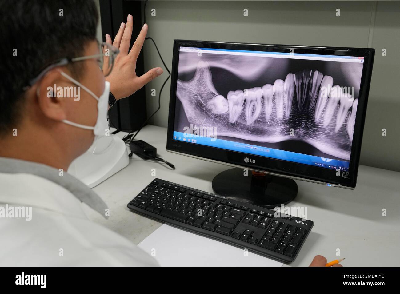 Lee Kyu-chang, a member of the central identification laboratory at the ...