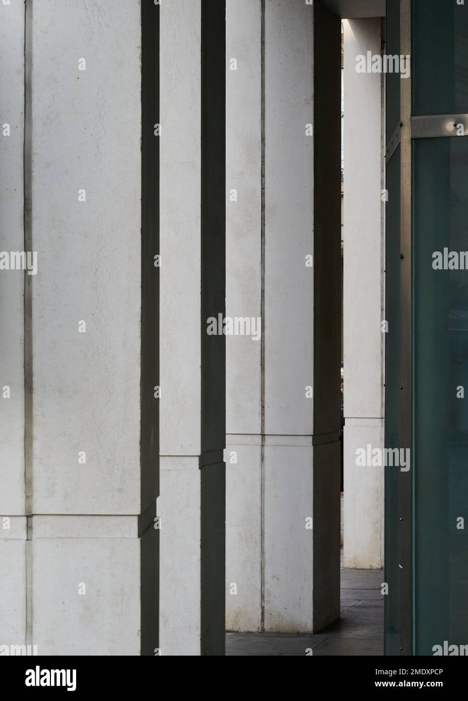 Patterns made on modern building columns in sunshine Stock Photo - Alamy