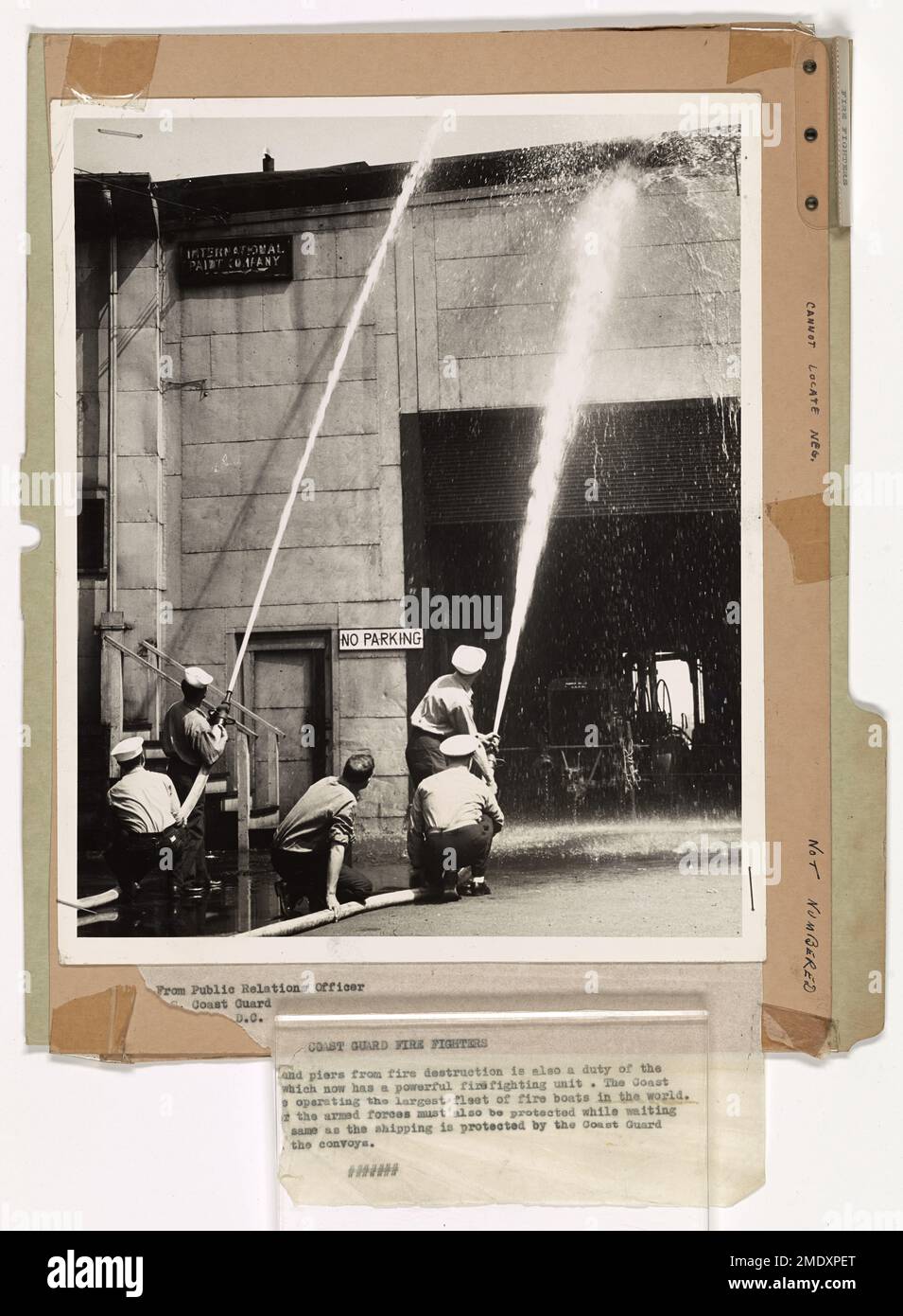 Coast Guard firefighters are shown fighting a fire aboard a vessel ...