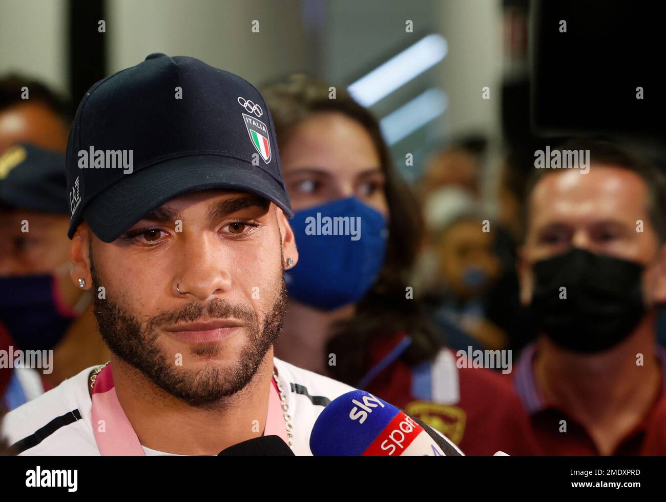 Italian sprinter Marcell Jacobs meets reporters after disembarking from ...