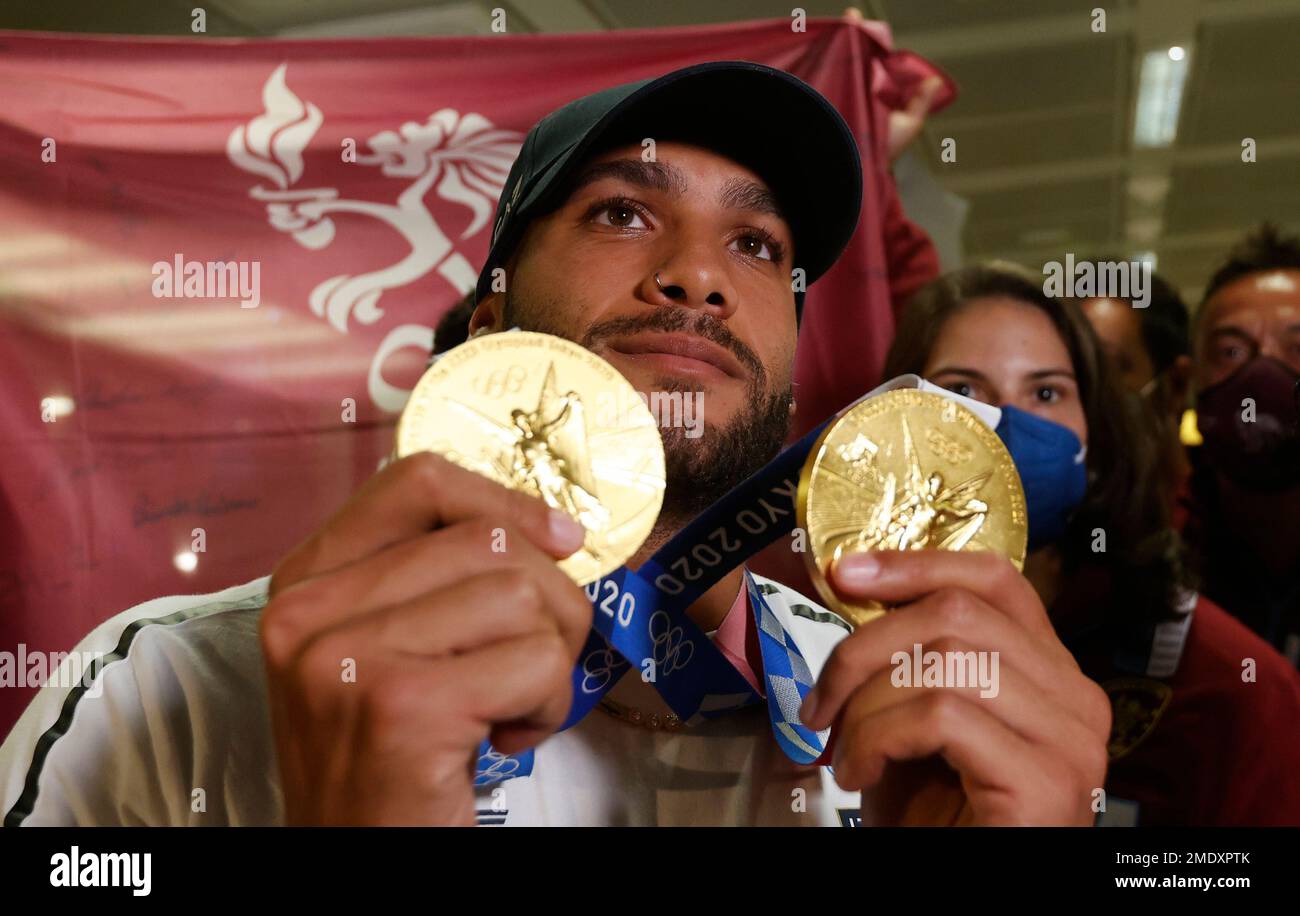Italian sprinter Marcell Jacobs shows his medals, won in the men's 100 ...