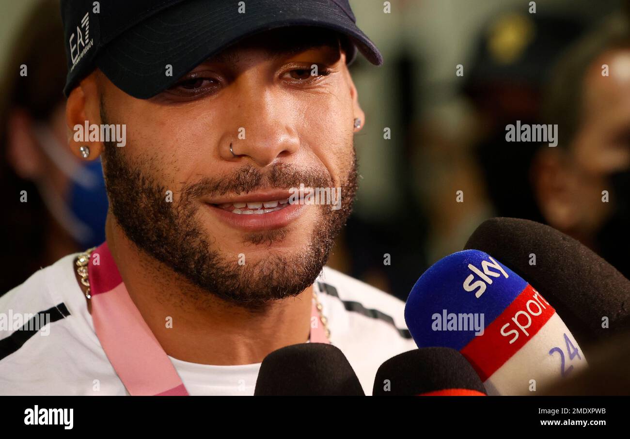 Italian sprinter Marcell Jacobs meets reporters after disembarking from ...