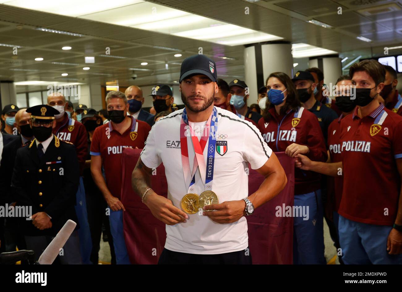 Italian sprinter Marcell Jacobs shows his medals, won in the men's 100 ...