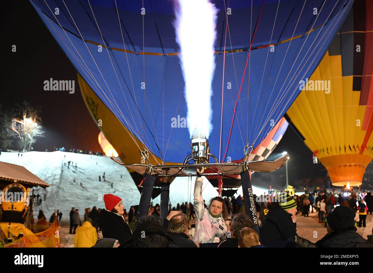 At the night of the balloons, the balloonists fire their balloons on ...