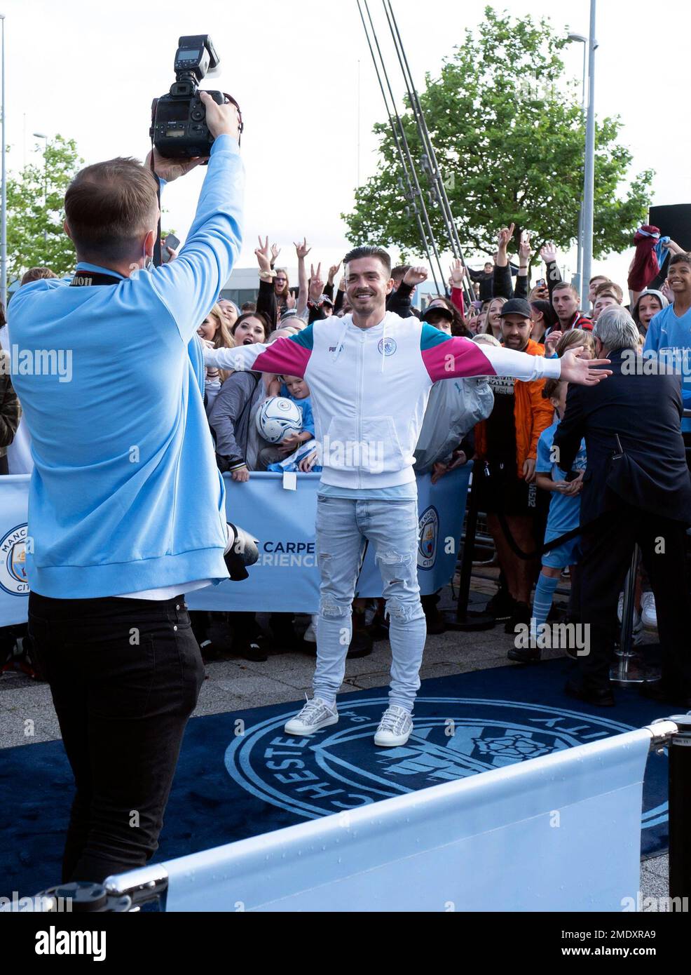 Manchester City's new signing Jack Grealish poses for a picture as he ...