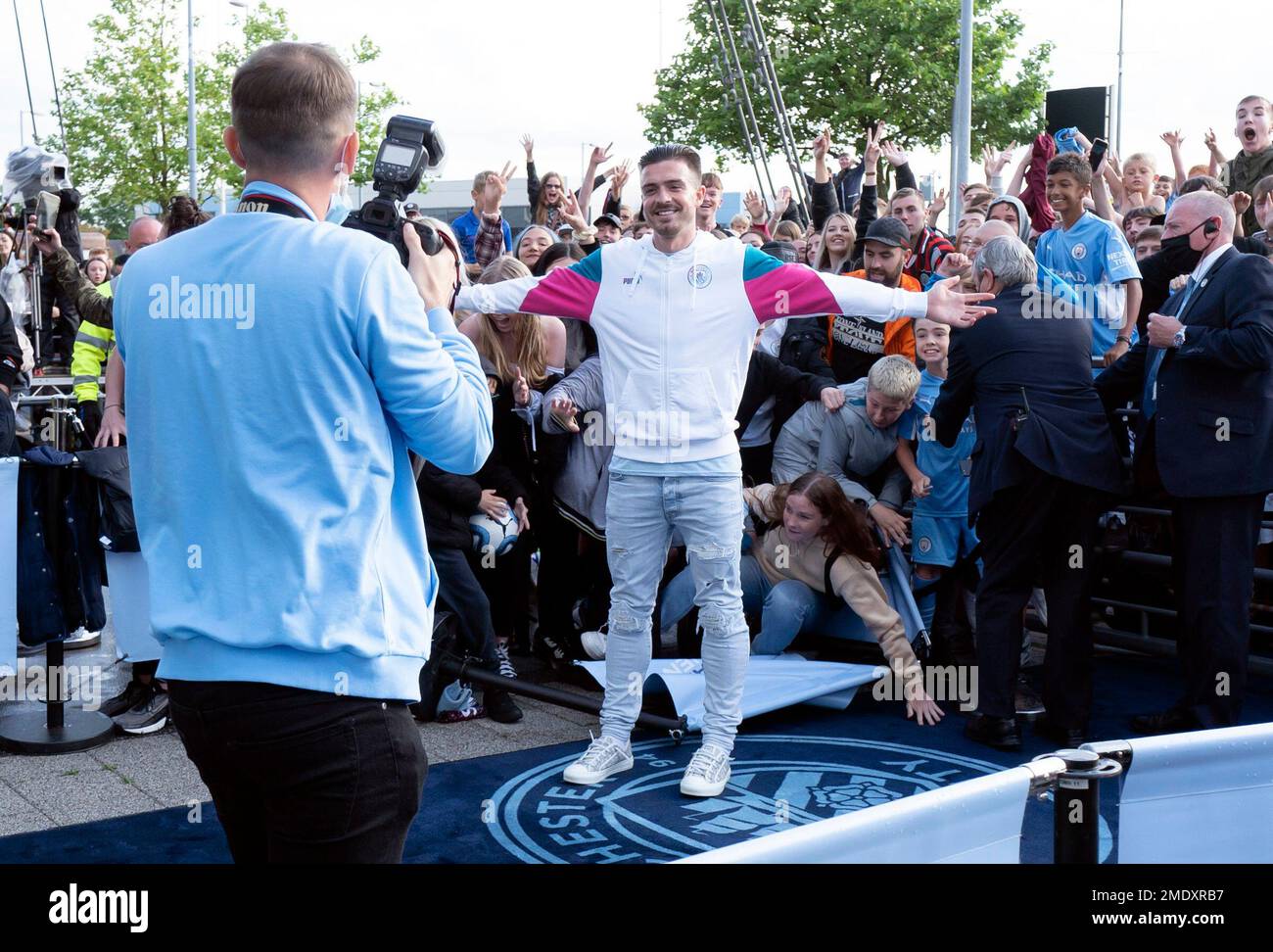 Manchester City's new signing Jack Grealish poses for a picture as he ...