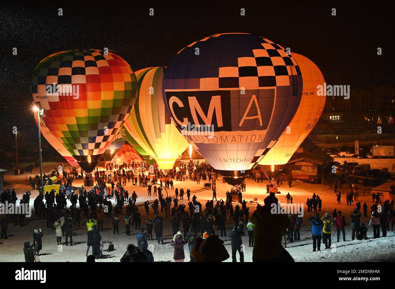At the night of the balloons, the balloonists fire their balloons on ...