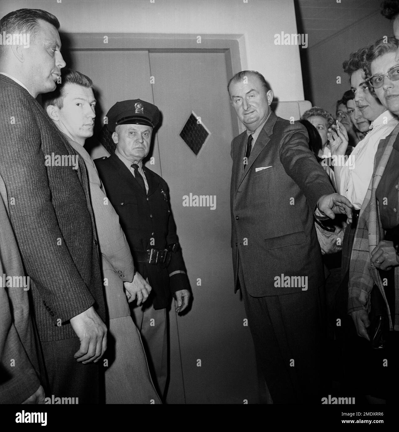 Chester "Rocky" Weger, left, glances over his shoulder as a deputy ...