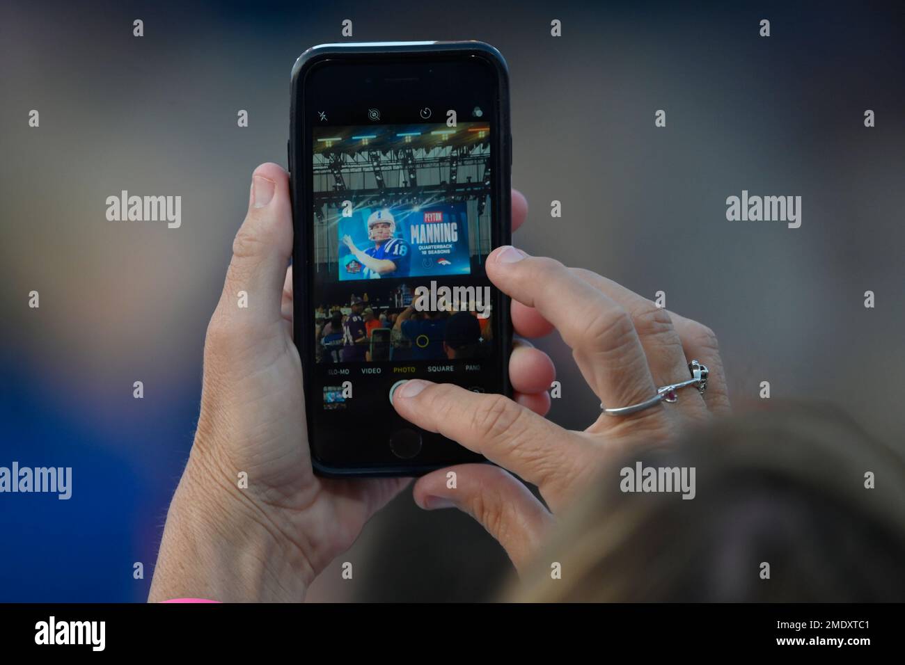 A fan takes a picture of the stage with a cell phone during the Pro ...