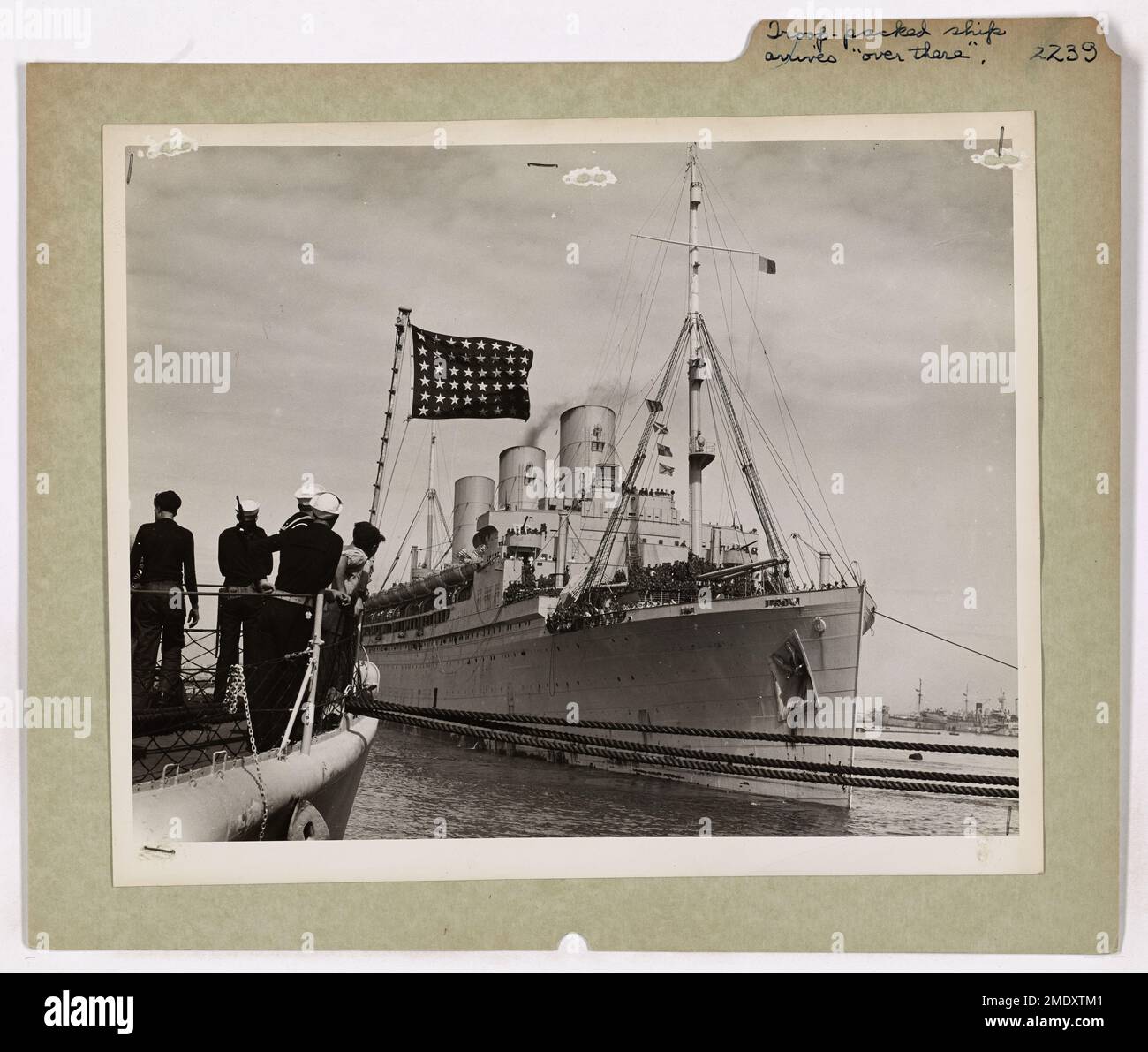 A Coast Guard Combat Photographer captures an American troop ship ...