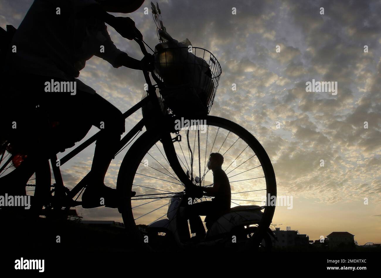 A vendor cycles to the market in Krang Angkrang village outside Phnom ...