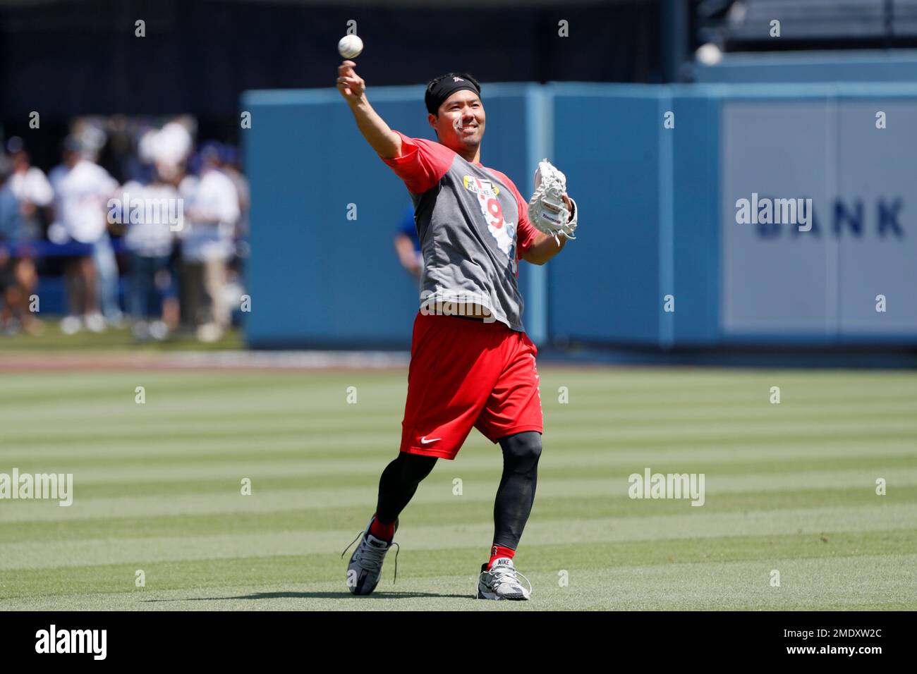 Los Angeles Angels' Kurt Suzuki throws during warmups before a baseball ...