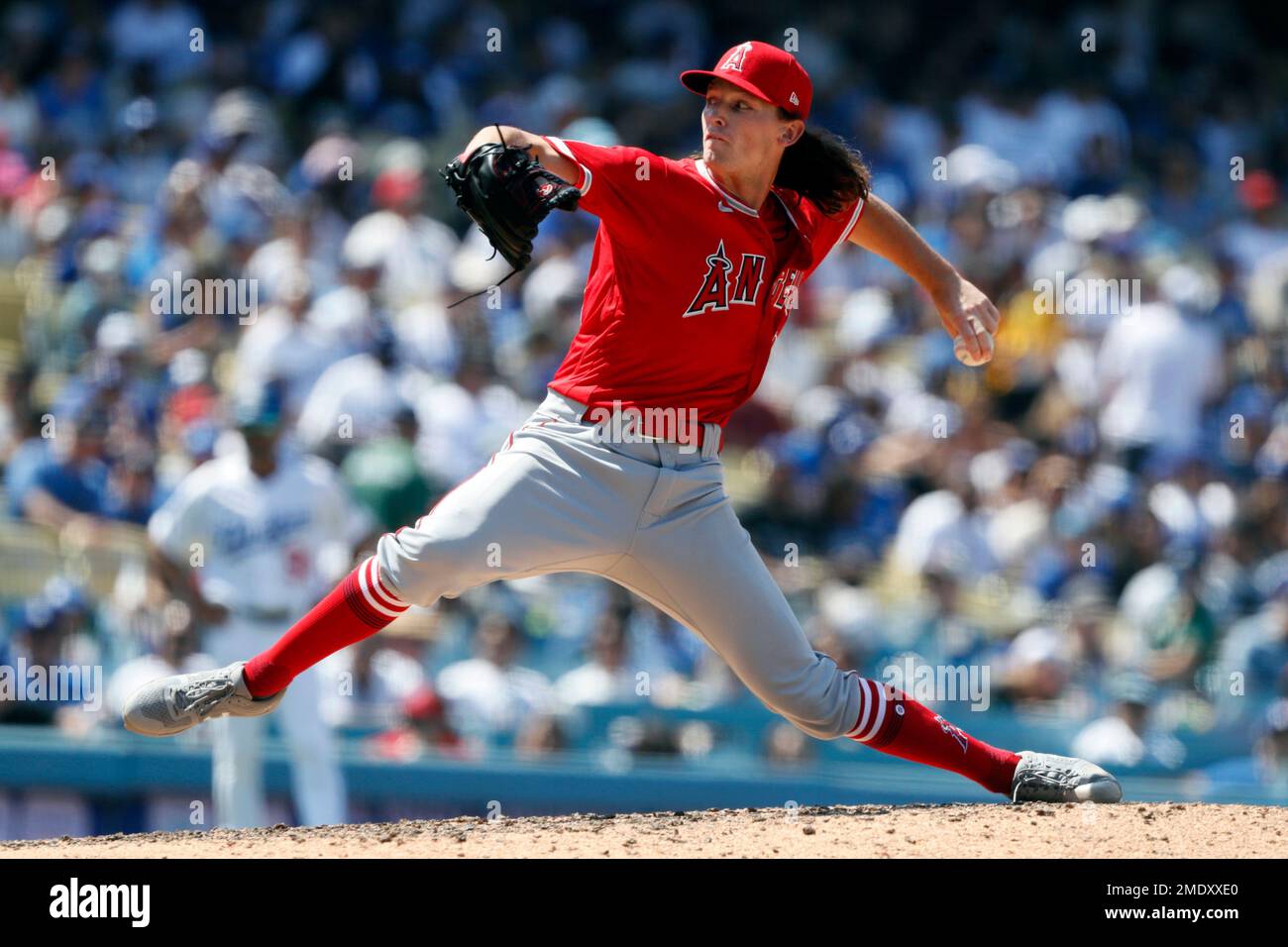 Los Angeles Angels relief pitcher Packy Naughton throws to a Los ...