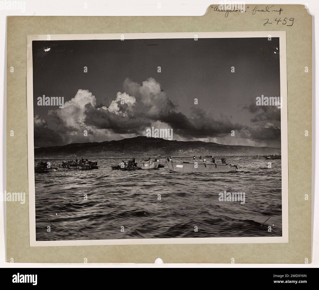 Coast Guard-manned landing barges and amphibious tractors, known as ...