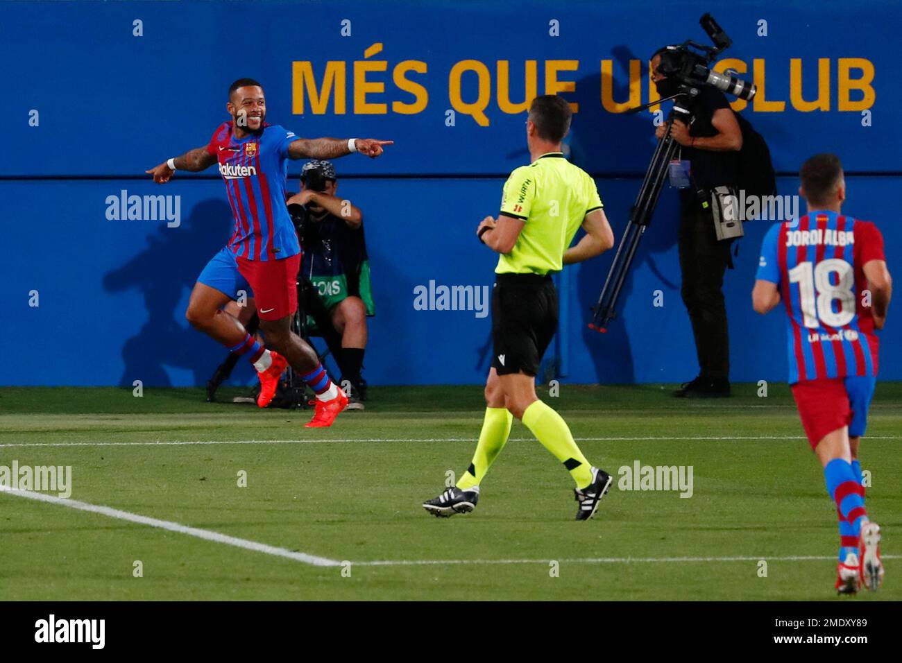 Barcelona's Memphis Depay, left, celebrates after scoring his side's ...