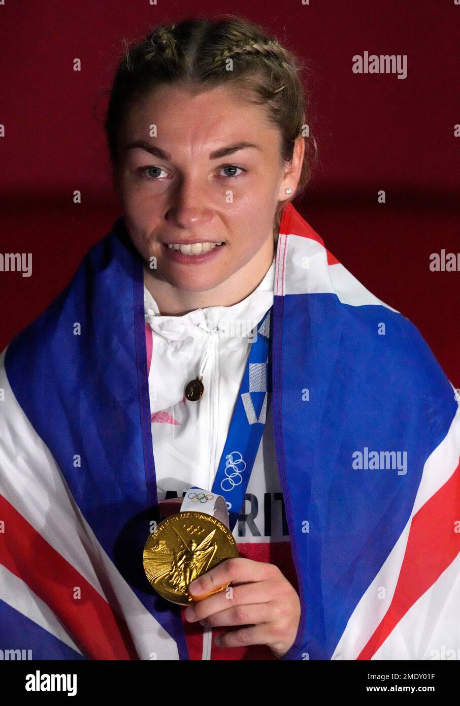 Britain's Lauren Price pose with her medal after the ceremony for their ...