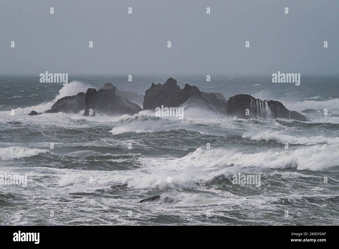 Waves crash on rocks in ocean during storm Stock Photo - Alamy