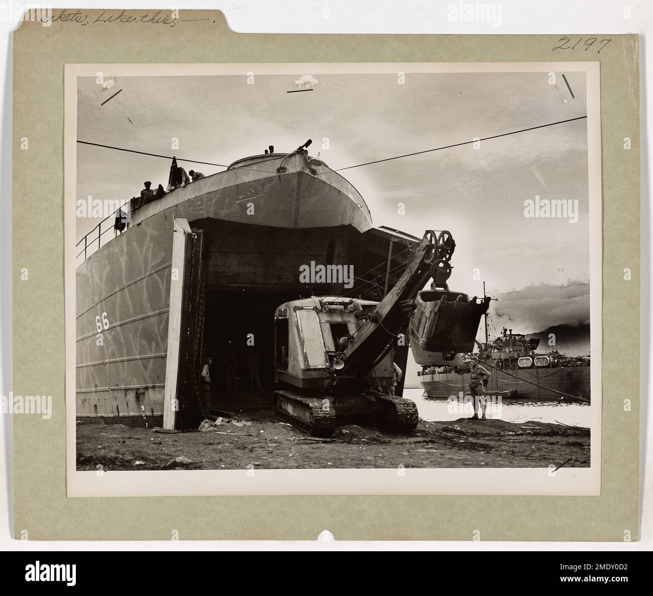 At an American South Pacific debarkation base, a steam shovel is loaded ...