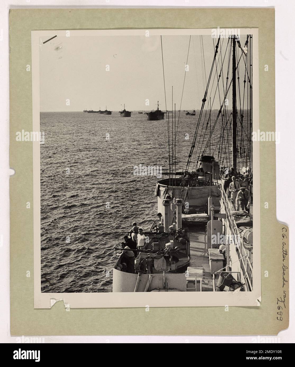 A Coast Guard combat cutter leads a convoy of Allied forces heading ...