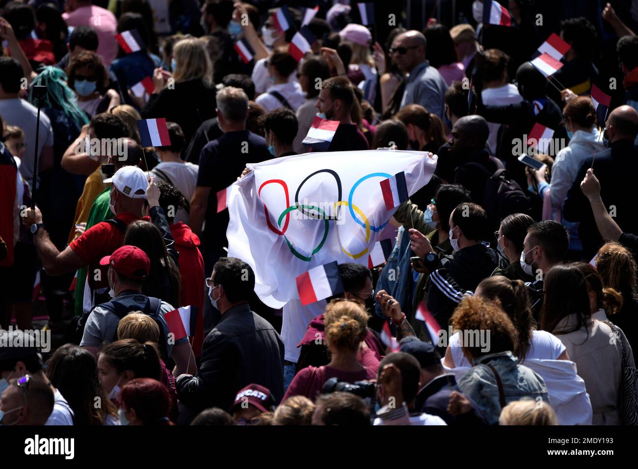 Fans carry a flag in the Olympics fan zone at Trocadero Gardens in ...