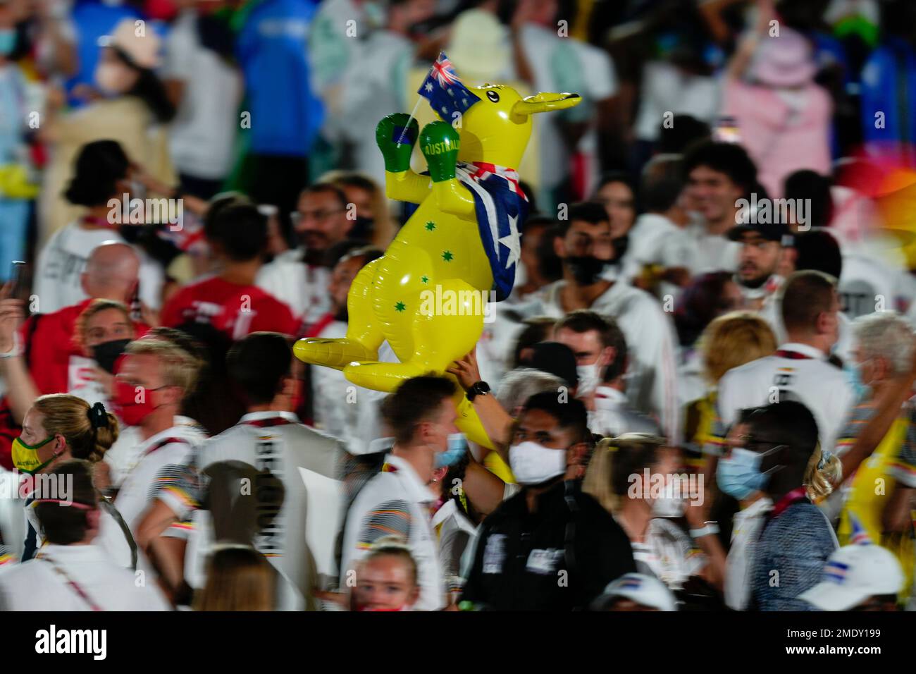 Athletes from Australia carry in an inflatable kangaroo during the ...