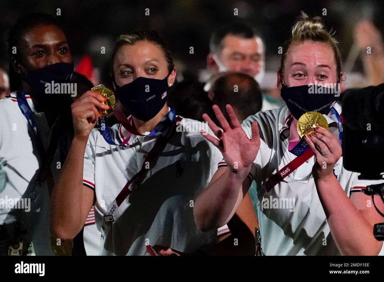 USA athletes show their gold medals during the closing ceremony in the ...