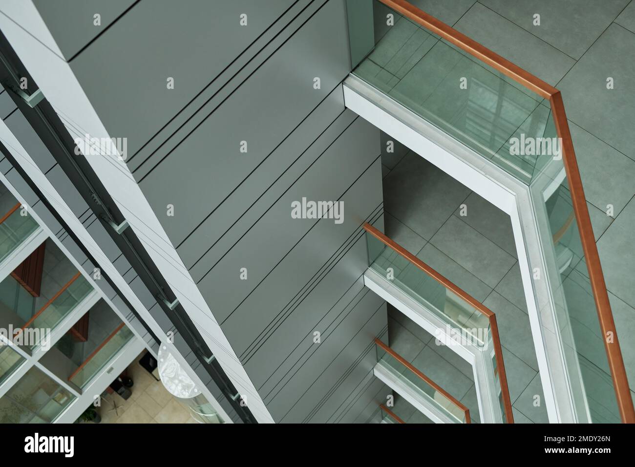 Above view of part of modern building interior with railings and ...