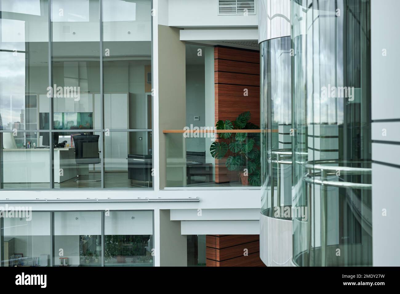 Large windows and modern spacious office with workplaces of white ...