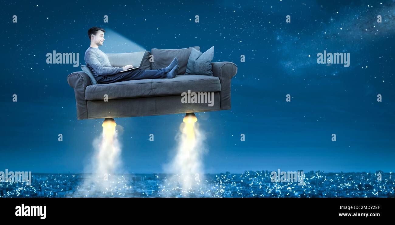 Person with a laptop computer sitting on a flying rocket sofa Stock ...