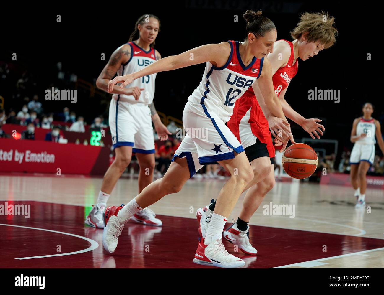 United States's Diana Taurasi (12) drives past Japan's Maki Takada (8 ...