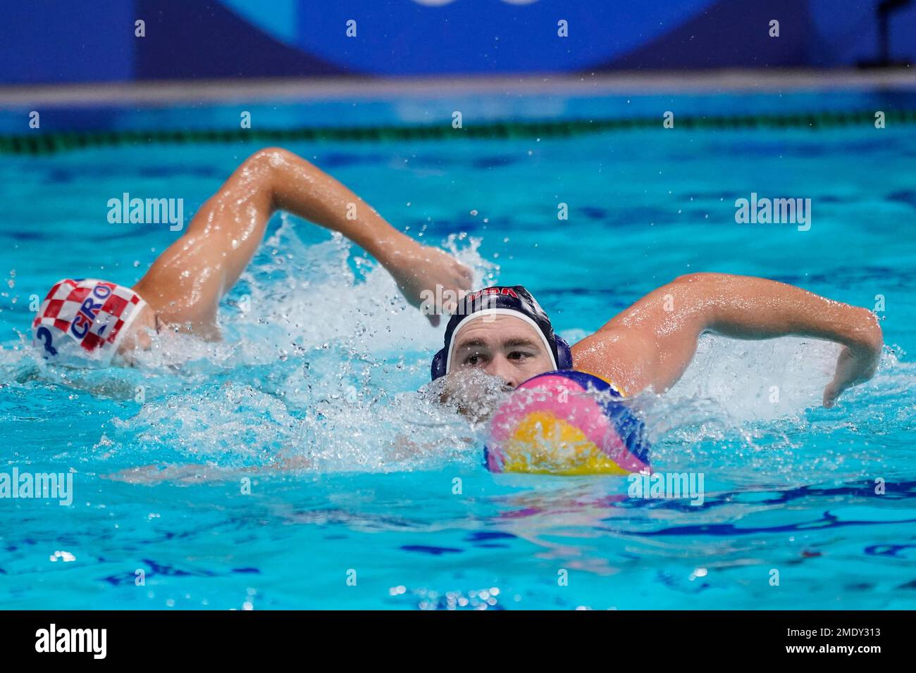 United States' Alex Bowen, right, swims ahead of Croatia's Loren ...