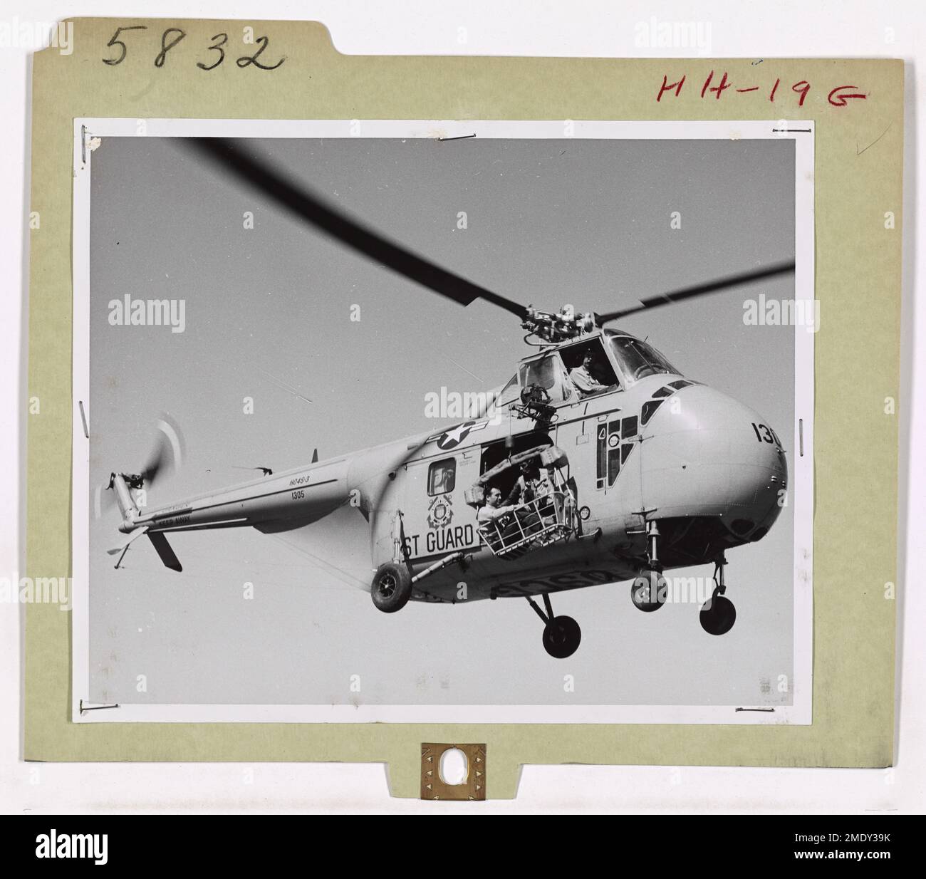 Helicopter Basket Rescue Demonstration. This image depicts a U.S. Coast ...