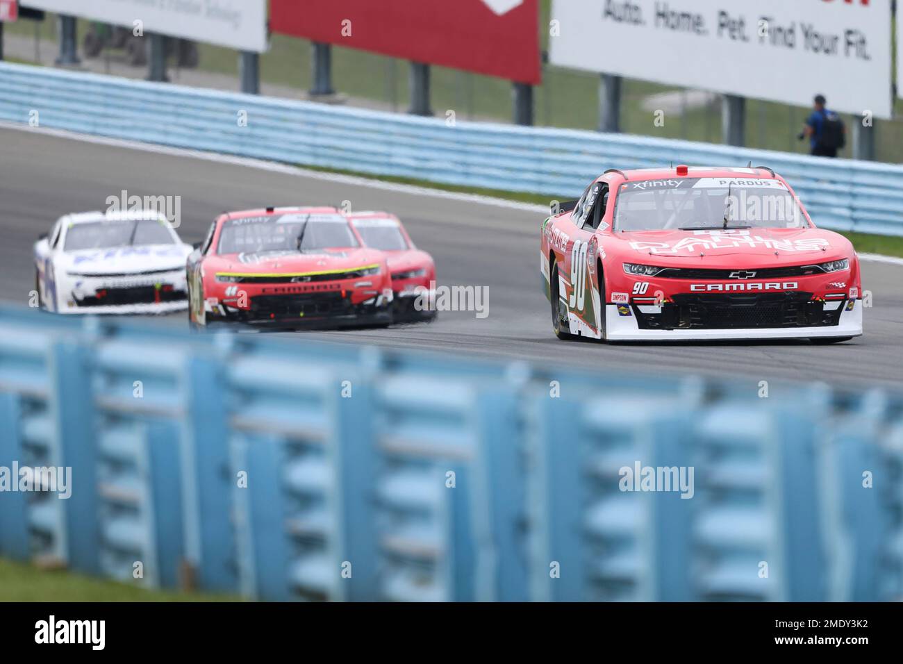 Preston Pardus, right, drives through the Esses in the NASCAR Xfinity ...