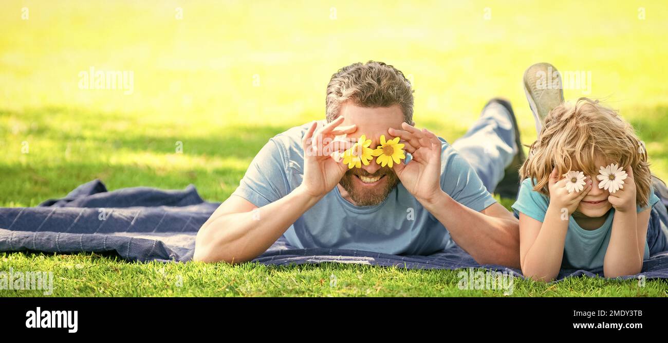 Banner of happy father with child relax together on green park grass ...