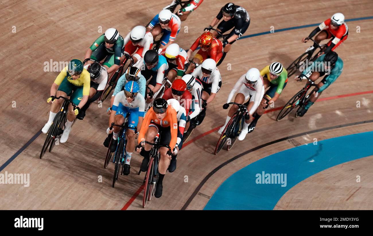 Athletes compete during the track cycling women's omnium scratch race ...