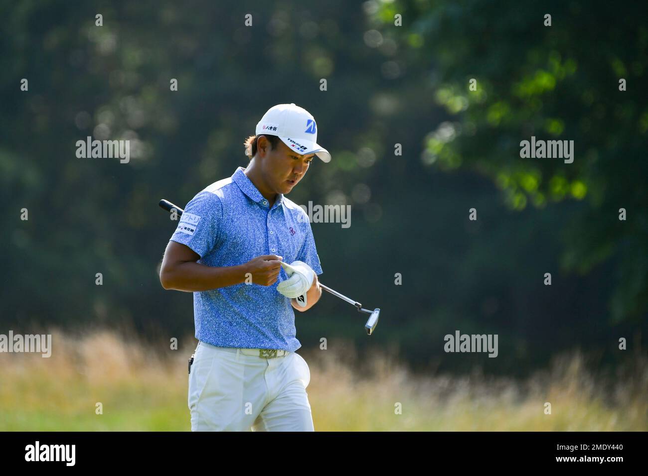 Ryosuke Kinoshita, of Japan, walks a fairway during the third round in ...